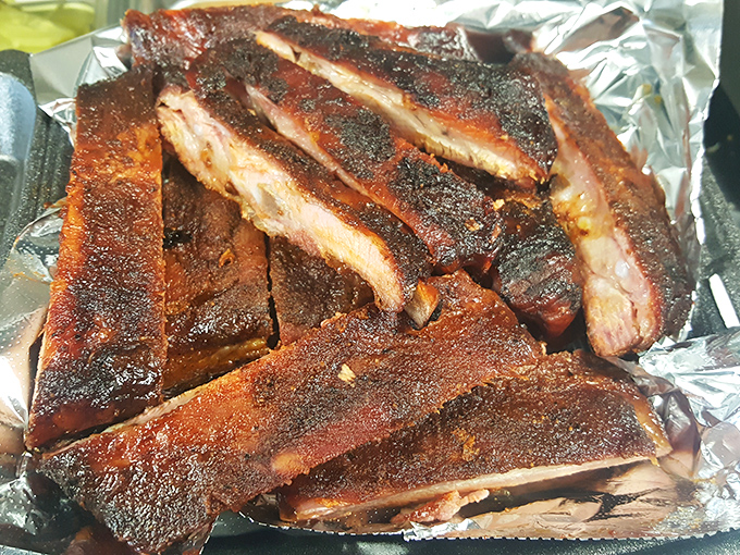 Ribs wearing that beautiful mahogany bark like a badge of honor, ready to fall off the bone with dignity.