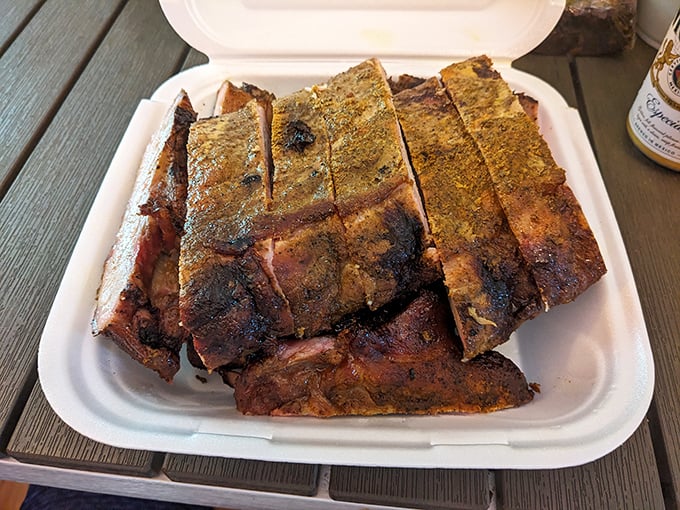 Ribs with that perfect "bark" on the outside, tender meat within. The kind that make you temporarily forget table manners exist.