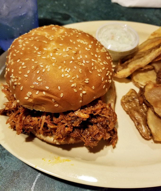 A barbecue sandwich that doesn't need fancy presentation&mdash;just a sesame seed bun to hold the smoky, tender mountain of meat. Those homemade chips aren't just sides, they're accomplices.