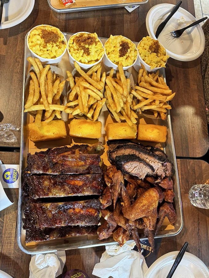 The BBQ platter that launches a thousand napkins. Four sides and three meats&mdash;mathematically speaking, that's happiness on a tray.