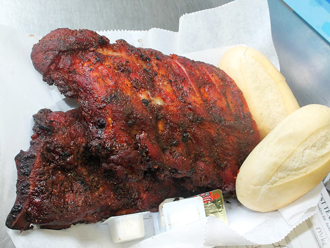 Baby back ribs with a bark so beautiful it should be hanging in a museum. That smoke ring is the barbecue equivalent of a halo.