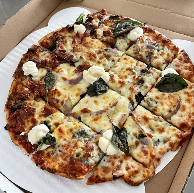 The Bacon Basil pizza &ndash; where smoky meets fresh, like a sophisticated dance between two ingredients that were clearly meant for each other.