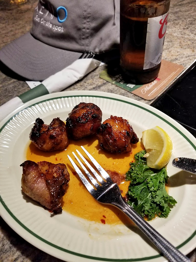 Bacon-wrapped scallops sitting in a pool of sauce that you'll be tempted to drink directly from the plate when no one's looking.
