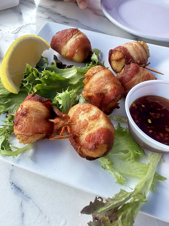 Bacon-wrapped scallops: proof that sometimes the ocean and farm should collaborate more often. Sweet meets savory in this classic appetizer.