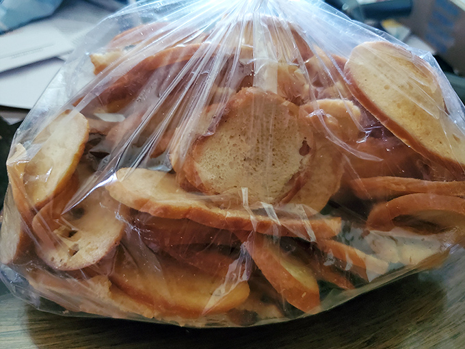 A bag of homemade bagel chips&mdash;the unsung heroes of the deli world. Crispy, seasoned perfection that makes potato chips seem like a sad compromise.