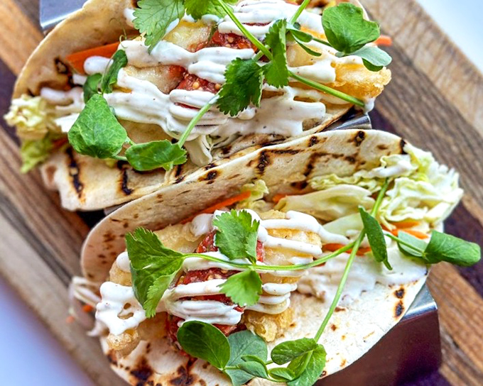 Fish tacos that make Tuesdays worth celebrating any day of the week. Crispy, creamy, and herbaceous&mdash;the holy trinity of taco perfection.