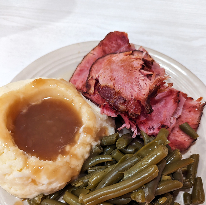 When ham looks this tender beside those green beans and gravy-topped mashed potatoes, vegetarianism suddenly seems negotiable.