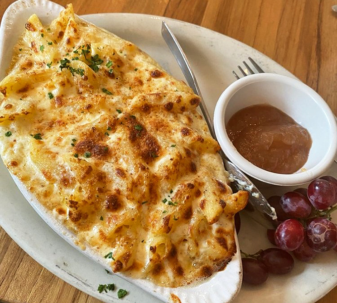 Mac and cheese that's dressed for a formal occasion, with a golden-brown crust that audibly crackles when your fork breaks through.