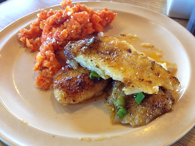 Delicate fish paired with vibrant carrot soufflé—proof that Louisiana cuisine isn't all about setting your taste buds on fire.