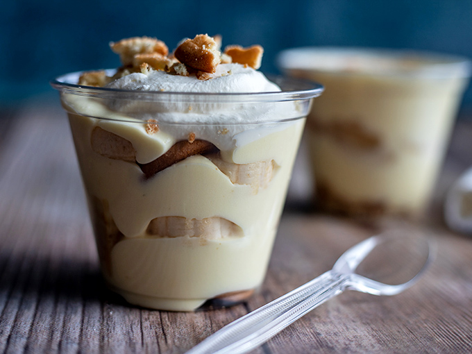 Banana pudding served in a clear cup&mdash;because they want you to see the layers of happiness before you dive in.