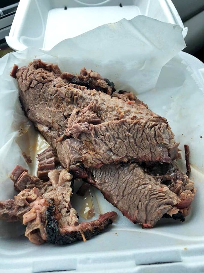 Brisket sliced thick with smoke rings that look like tree rings, telling tales of patient perfection.