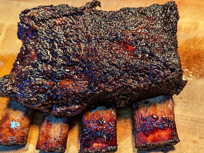 These beef ribs aren't just dinner&mdash;they're prehistoric monuments to carnivorous joy. Fred Flintstone would weep with happiness at the sight.