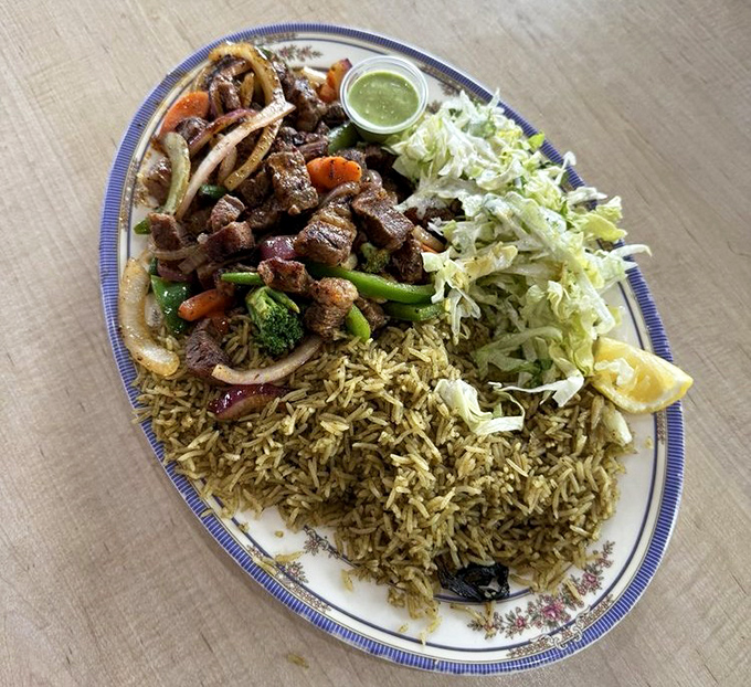 Beef suqaar with fragrant rice and fresh salad&mdash;a balanced meal that somehow feels like an indulgence. Your diet plan just called to negotiate terms.