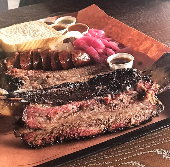 Behold the holy grail of barbecue: beef ribs with a bark so perfect it should be hanging in the Louvre. That smoke ring deserves its own fan club.