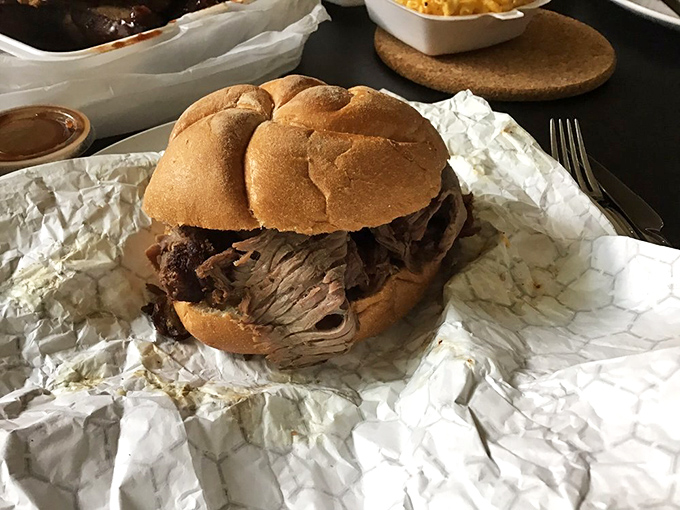 A beef sandwich so generously stuffed it requires both hands and a strategic eating plan. The soft roll knows its supporting role perfectly.