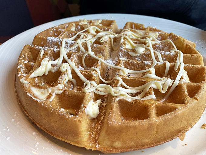 A Belgian waffle wearing its Sunday best&mdash;golden, crisp, and drizzled with enough cream to make you forget you ever worried about cholesterol.