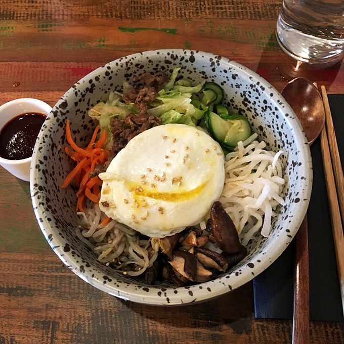 Bibimbap arrives like edible art &ndash; mix it up and watch the magic happen in your bowl.