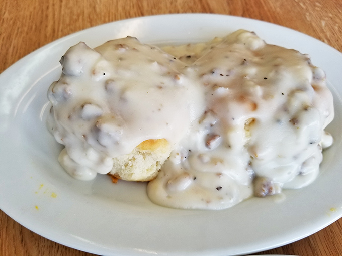 Biscuits and gravy so authentic they should come with their own Southern accent. That pepper-speckled gravy blanket is comfort in edible form.