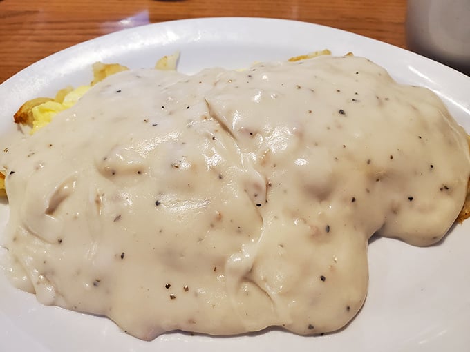 Biscuits and gravy so good they should be regulated by the FDA. This creamy, peppery blanket of goodness transforms ordinary biscuits into breakfast royalty.
