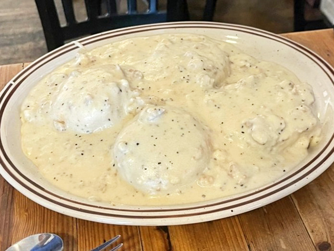 Biscuits and gravy: the breakfast equivalent of a standing ovation. That peppery cream gravy cascading over fresh-baked goodness is pure morning poetry.