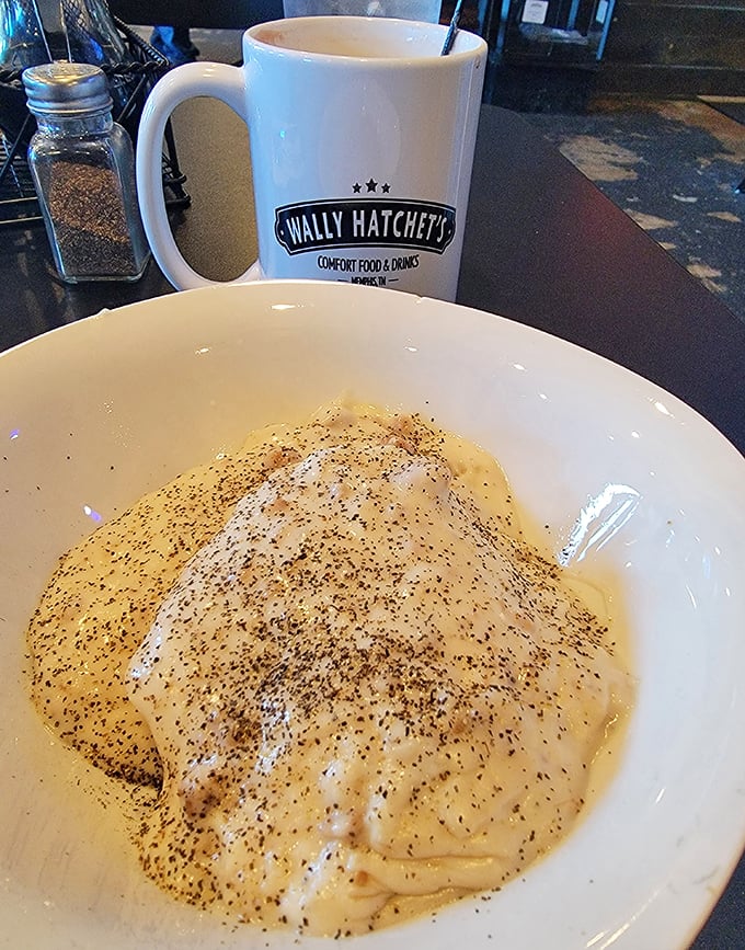 Comfort in a bowl – creamy biscuits swimming in pepper-flecked gravy, the breakfast equivalent of a warm hug.