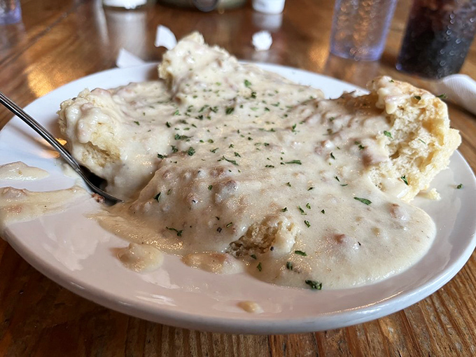 Behold, the blanket of creamy gravy that dreams are made of. These biscuits aren't just covered &ndash; they're tucked in for a delicious nap.