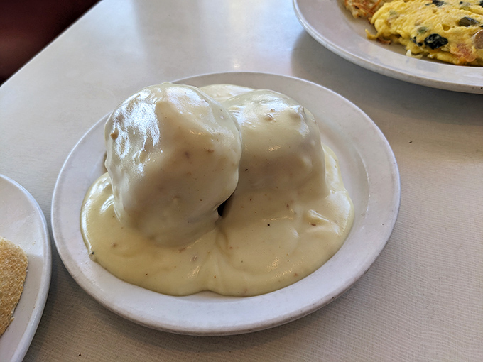 These biscuits and gravy look like they're wearing a warm, peppery blanket&mdash;comfort food in its purest, most huggable form.