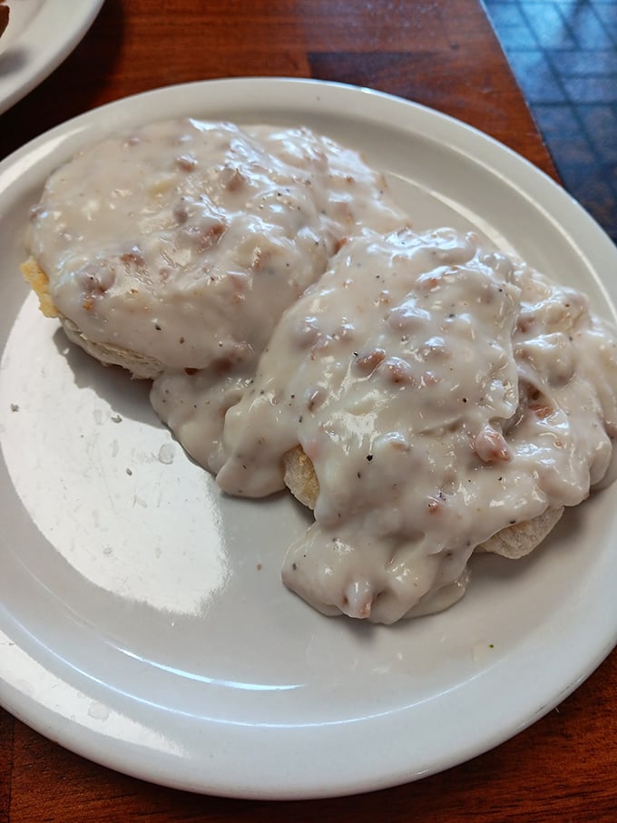Biscuits and gravy: the breakfast equivalent of a warm hug from your favorite grandparent, smothered in peppery comfort and zero pretension.
