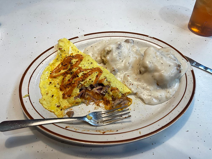 An omelet that means business paired with biscuits and gravy&mdash;the breakfast equivalent of a warm Southern hug.
