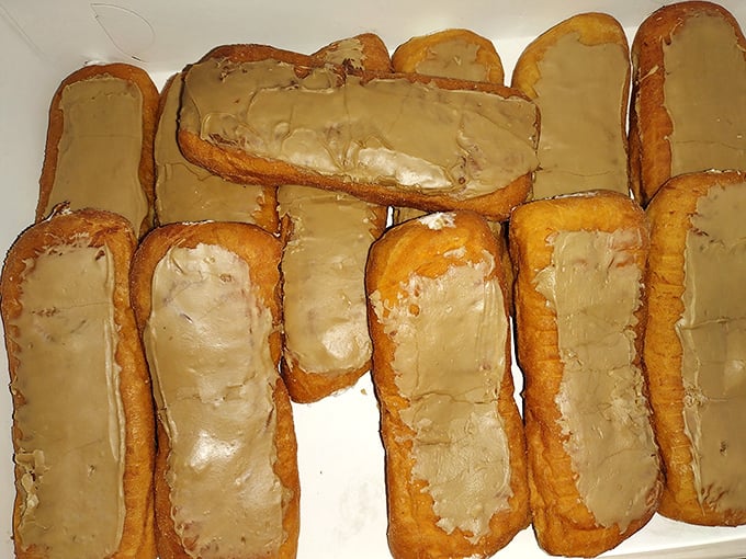 These maple-iced Bismarcks aren't just donuts—they're vessels of creamy filling waiting to transport you to a state of pure bliss.