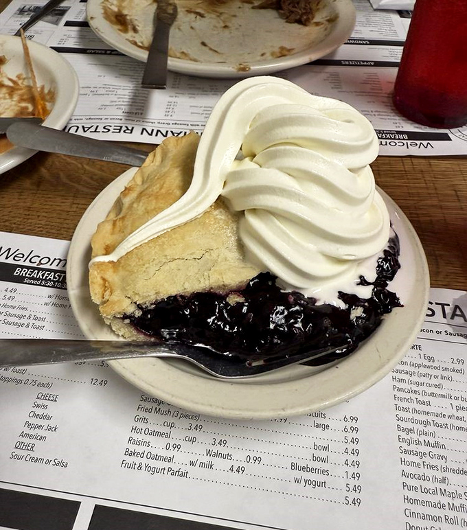Pie perfection! That towering meringue isn't showing off—it's just confident in its ability to make you forget every diet resolution you've ever made.