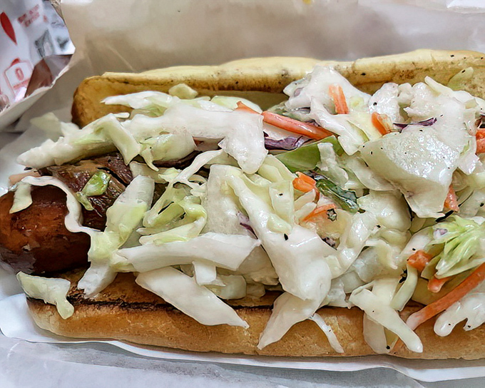 The "Blaze" hot dog lives up to its fiery name with a mountain of fresh slaw providing cool relief from the heat&mdash;a delicious balancing act.