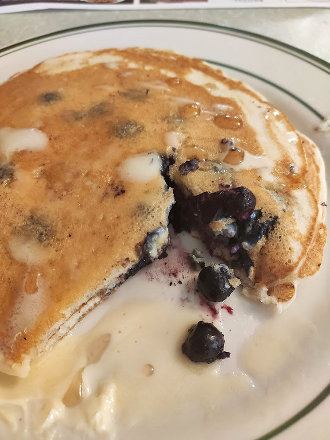 These blueberry pancakes aren't just breakfast&mdash;they're edible poetry. Each berry creates pockets of warm, purple joy in a fluffy golden canvas.