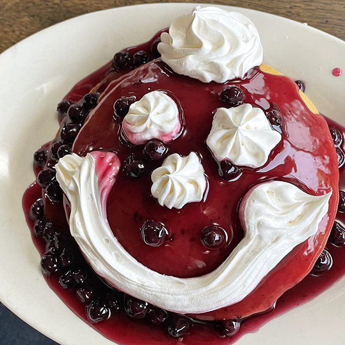 Berry-topped pancakes with whipped cream swirls aren't just breakfast – they're edible art that somehow tastes even better than they look.
