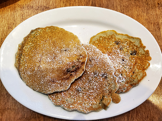 These blueberry pancakes dusted with powdered sugar aren't just breakfast – they're an argument against ever skipping the most important meal of the day.