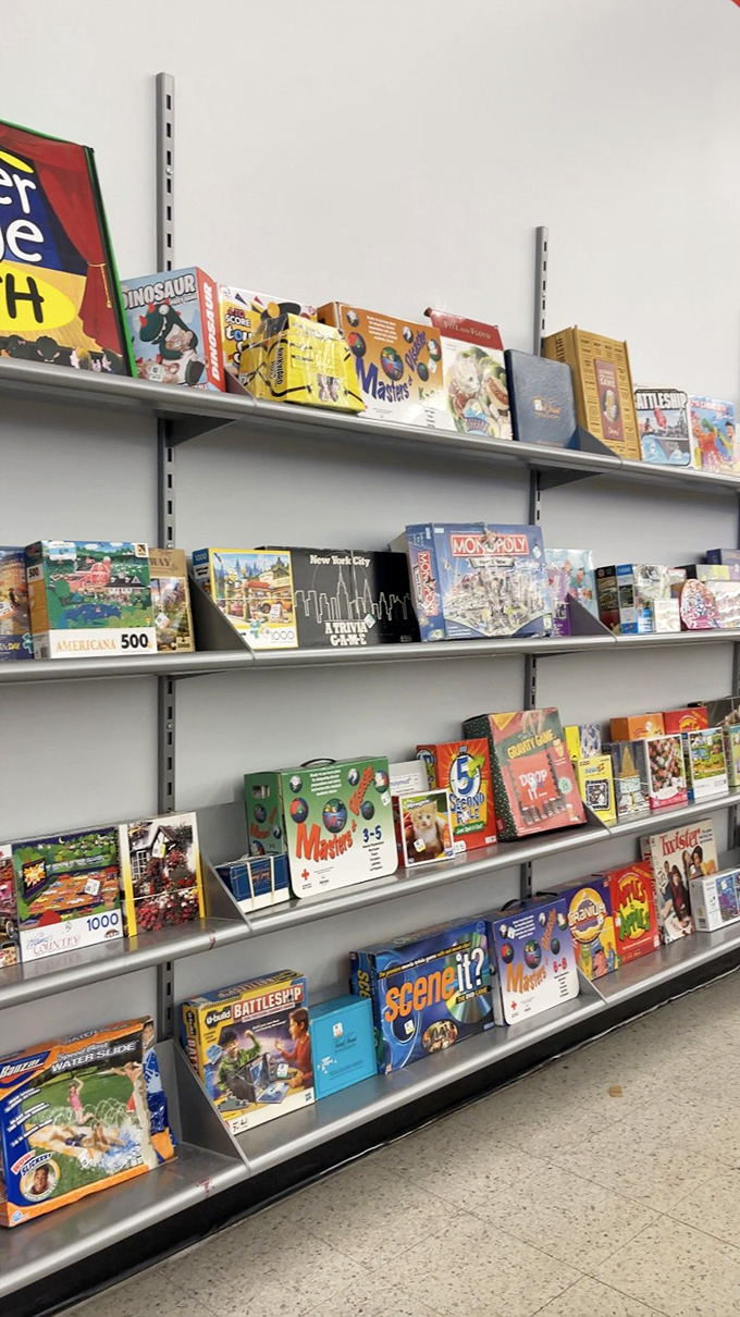 Board games and puzzles line the shelves like dormant adventures, waiting for new families to bring them back to life.