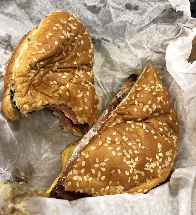 The half-eaten burger tells the real story&mdash;patience for photography lasts exactly two seconds when faced with this level of deliciousness. Some pleasures simply can't wait.