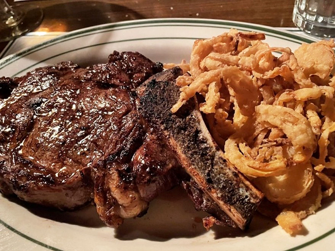 The bone-in ribeye with those golden onion rings &ndash; a combination so perfect it should have its own national holiday.