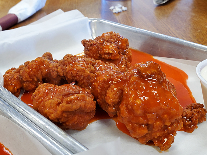 These boneless wings aren't messing around. That vibrant orange sauce promises a flavor adventure your taste buds will be talking about for days.