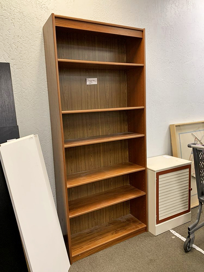 This bookcase isn't just furniture—it's potential. Empty shelves waiting to be filled with your literary treasures or tchotchkes.