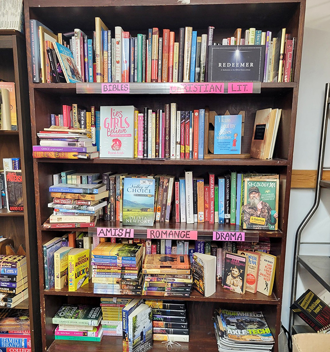 The bookshelf reveals Ohio's reading habits—Amish romance novels share space with Christian literature and self-help guides. Literary archaeology at its finest.