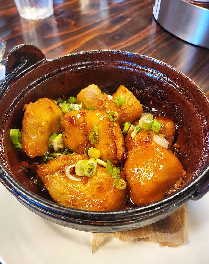 This clay pot of caramelized catfish isn't just dinner&mdash;it's a masterclass in slow-cooked perfection that would make your grandmother weep with joy.