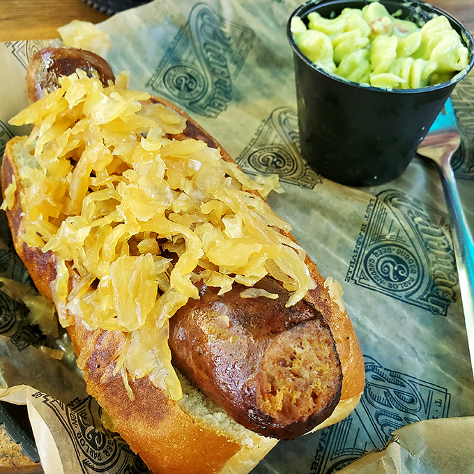 This bratwurst topped with sauerkraut isn't just a sausage&mdash;it's a direct portal to a Munich beer garden without the airfare.