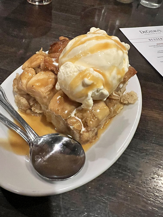 Bread pudding topped with ice cream and caramel: because sometimes dessert needs to be an event, not an afterthought.