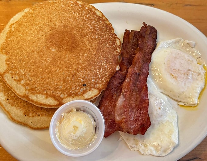 Pancakes the size of frisbees, bacon cooked to perfection, and eggs that remind you why breakfast deserves its legendary status.