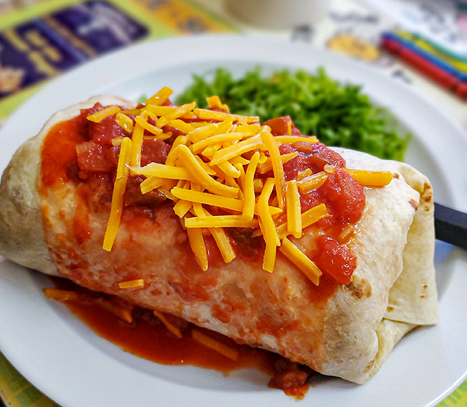 This breakfast burrito isn't just wrapped&mdash;it's hugging its fillings with tortilla love while that cheese melts like your resistance.