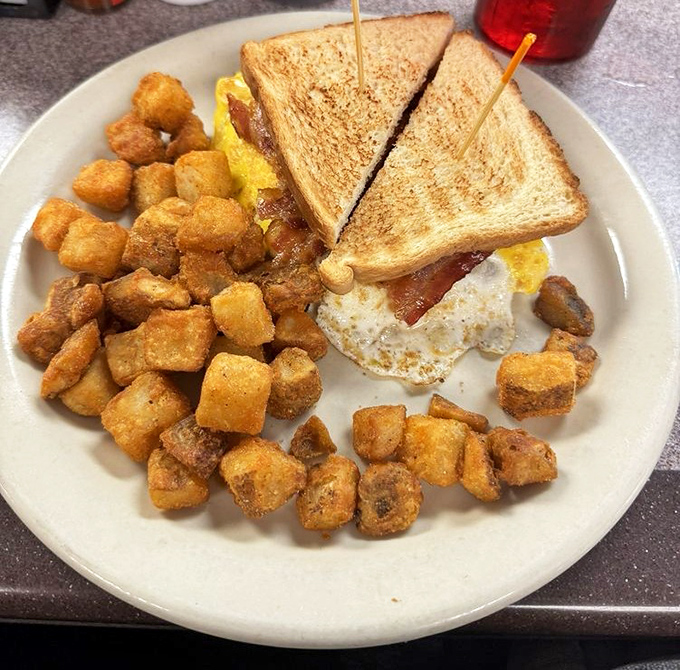 The breakfast trinity: perfectly toasted bread, golden hash browns, and eggs with that ideal runny-but-not-too-runny sweet spot. Hallelujah!