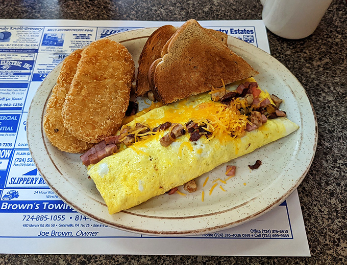 The breakfast omelet that answers the eternal question: "Why choose between breakfast foods when you can have them all on one plate?"