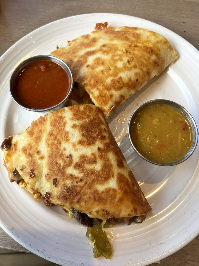 The Breakfast Quesadilla: where melty cheese meets crispy tortilla in a handheld masterpiece that makes you wonder why we don't quesadilla everything. 