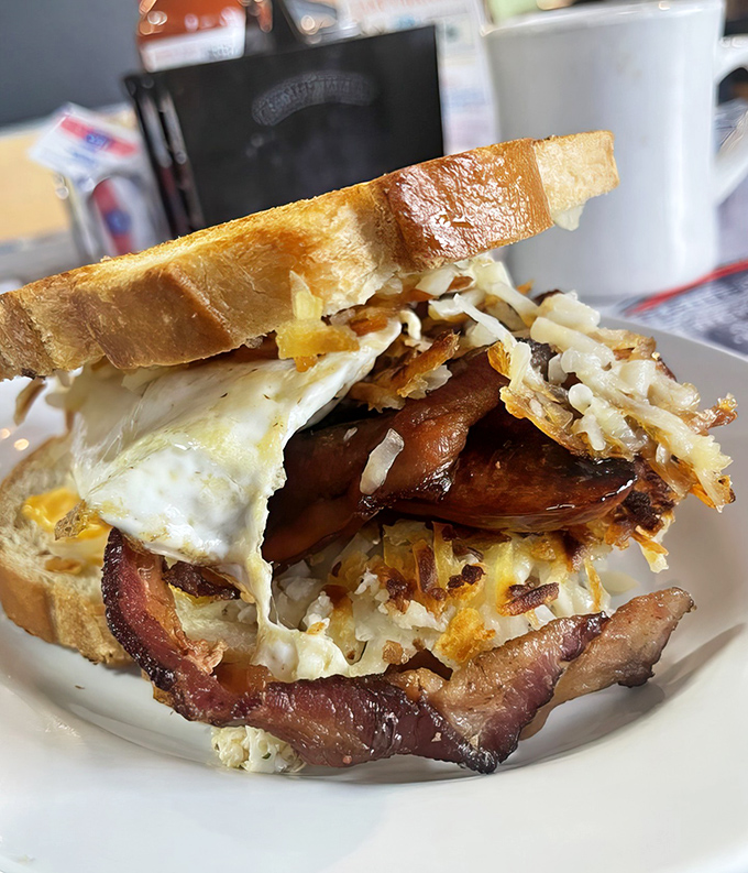The breakfast sandwich that laughs at your diet plans&mdash;golden toast barely containing a glorious avalanche of eggs, hash browns, cheese, and bacon that means business.